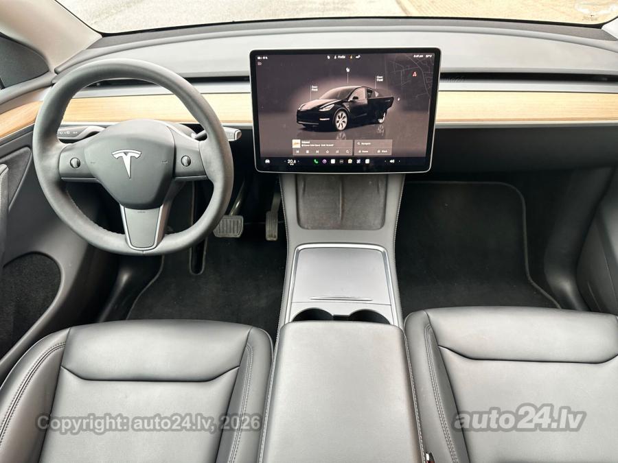 White Tesla Model Y 2023 in Tallinn, with an engine capacity of 0.00 L and mileage of 99 thousand km for 33700 €, photo 10 on AUTOMOTO.COM.LV