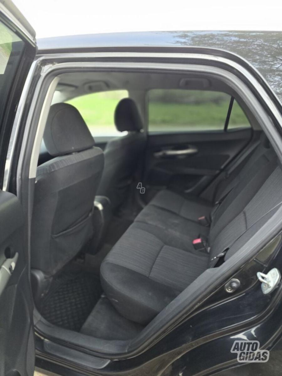 Black Toyota Auris 2009 in Plunge, with an engine capacity of 2.00 L and mileage of 285 thousand km for 1900 €, photo 11 on AUTOMOTO.COM.LV
