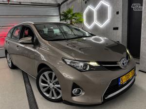 Brown Toyota Auris 2014 in Kaunas, with an engine capacity of 1.80 L and mileage of 280 thousand km for 7950 €, photo 4 on AUTOMOTO.COM.LV