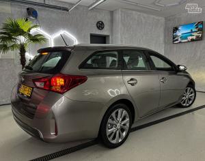 Brown Toyota Auris 2014 in Kaunas, with an engine capacity of 1.80 L and mileage of 280 thousand km for 7950 €, photo 6 on AUTOMOTO.COM.LV