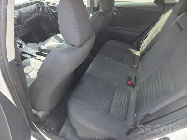 White Toyota Auris 2018 in Riga, with an engine capacity of 1.80 L and mileage of 290 thousand km for 9000 €, photo 9 on AUTOMOTO.COM.LV