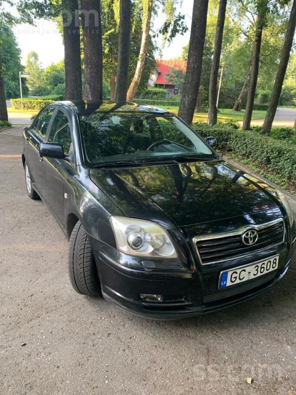 Black Toyota Avensis 2004 in Riga, with an engine capacity of 1.80 L and mileage of 150 thousand km for 1900 €, photo 1 on AUTOMOTO.COM.LV