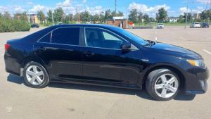 Black Toyota Camry 2013 in Siauliai, with an engine capacity of 2.49 L and mileage of 207 thousand km for 7850 €, photo 6 on AUTOMOTO.COM.LV