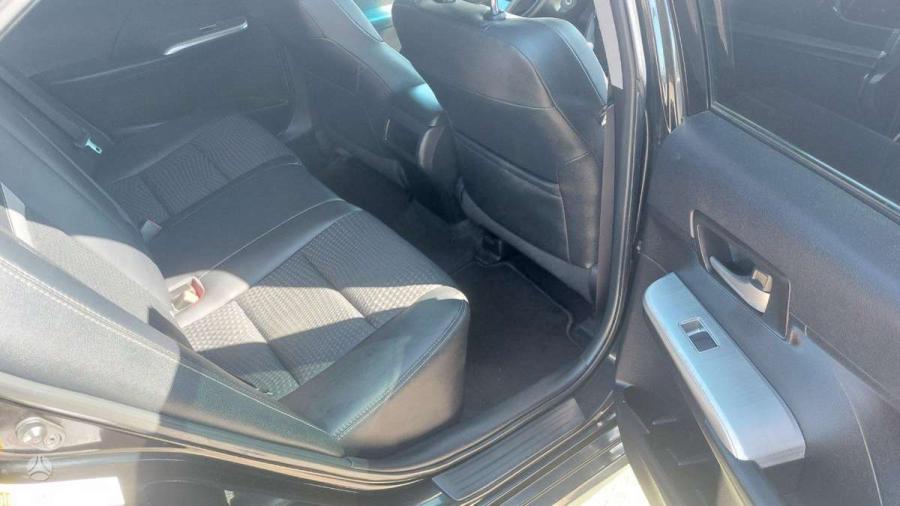 Black Toyota Camry 2013 in Siauliai, with an engine capacity of 2.49 L and mileage of 207 thousand km for 7850 €, photo 14 on AUTOMOTO.COM.LV