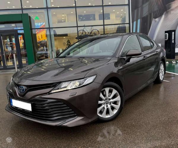 Brūns Toyota Camry 2019 Kauņa, ar dzinēja tilpumu 2.49 L un nobraukumu 58 tūkst. km par 22300 €, foto 1 vietnē AUTOMOTO.COM.LV