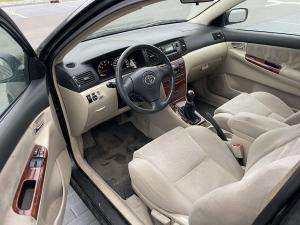 Black Toyota Corolla 2003 in Kaunas, with an engine capacity of 1.60 L and mileage of 284 thousand km for 650 €, photo 10 on AUTOMOTO.COM.LV
