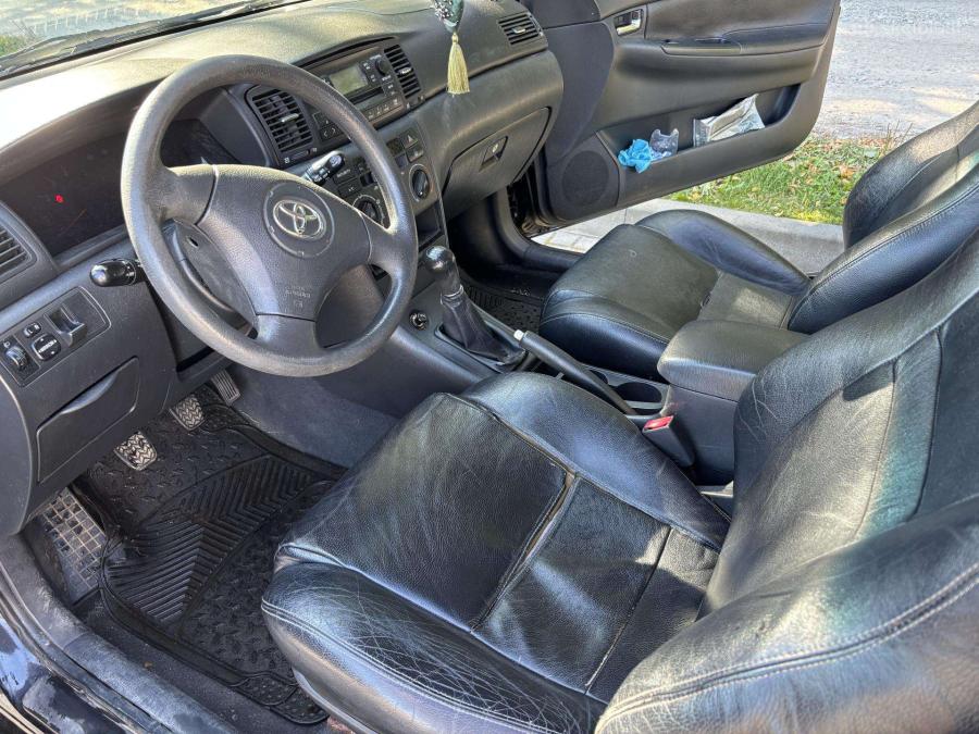 Black Toyota Corolla 2003 in Kaunas, with an engine capacity of 1.90 L and mileage of 347 thousand km for 410 €, photo 7 on AUTOMOTO.COM.LV