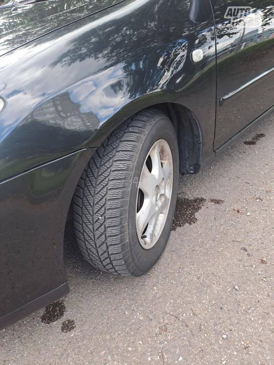 Melns Toyota Corolla 2006 Viļņa, ar dzinēja tilpumu 2.00 L un nobraukumu 305 tūkst. km par 1850 €, foto 17 vietnē AUTOMOTO.COM.LV