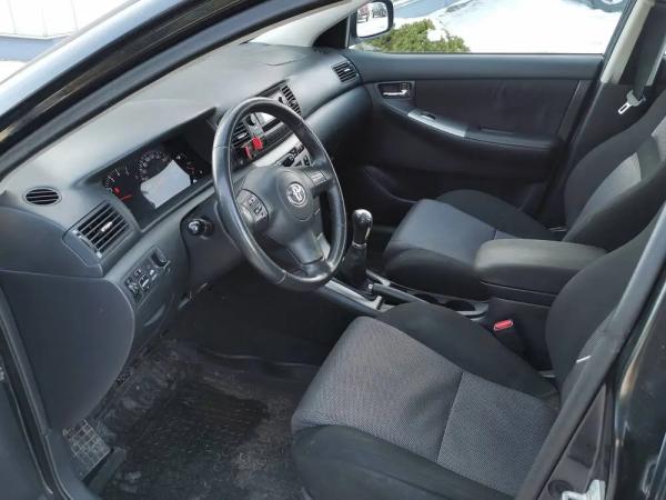 Black Toyota Corolla 2007 in Kuldiga, with an engine capacity of 1.40 L and mileage of 264 thousand km for 2200 €, photo 9 on AUTOMOTO.COM.LV