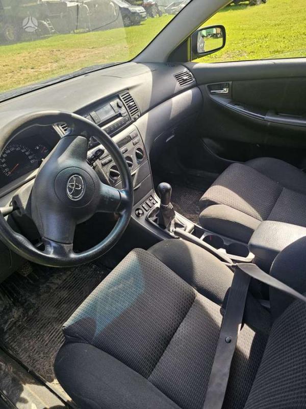 Blue Toyota Corolla 2006 in Jurbarkas, with an engine capacity of 1.36 L and mileage of 311 thousand km for 850 €, photo 4 on AUTOMOTO.COM.LV