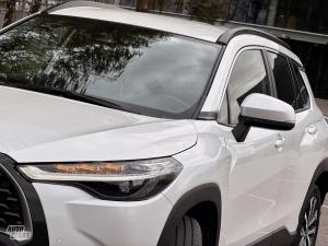 White Toyota Corolla Cross 2023 in Vilnius, with an engine capacity of 2.00 L and mileage of 46 thousand km for 34900 €, photo 24 on AUTOMOTO.COM.LV