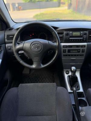 Grey Toyota Corolla 2002 in Vilnius, with an engine capacity of 2.00 L and mileage of 295 thousand km for 1250 €, photo 11 on AUTOMOTO.COM.LV