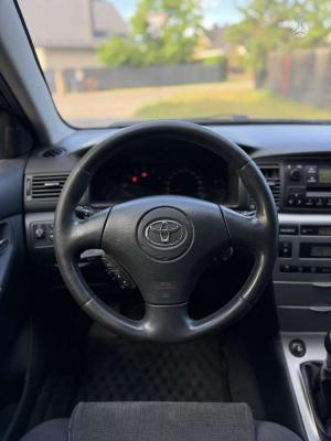 Grey Toyota Corolla 2002 in Vilnius, with an engine capacity of 2.00 L and mileage of 295 thousand km for 1250 €, photo 12 on AUTOMOTO.COM.LV