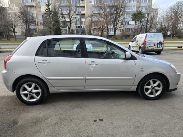 Grey Toyota Corolla 2003 in Kaunas, with an engine capacity of 2.00 L and mileage of 320 thousand km for 1400 €, photo 9 on AUTOMOTO.COM.LV