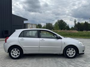 Grey Toyota Corolla 2003 in Panevezys, with an engine capacity of 2.00 L and mileage of 322 thousand km for 1050 €, photo 6 on AUTOMOTO.COM.LV