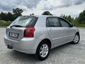 Grey Toyota Corolla 2003 in Panevezys, with an engine capacity of 2.00 L and mileage of 322 thousand km for 1050 €, photo 7 on AUTOMOTO.COM.LV