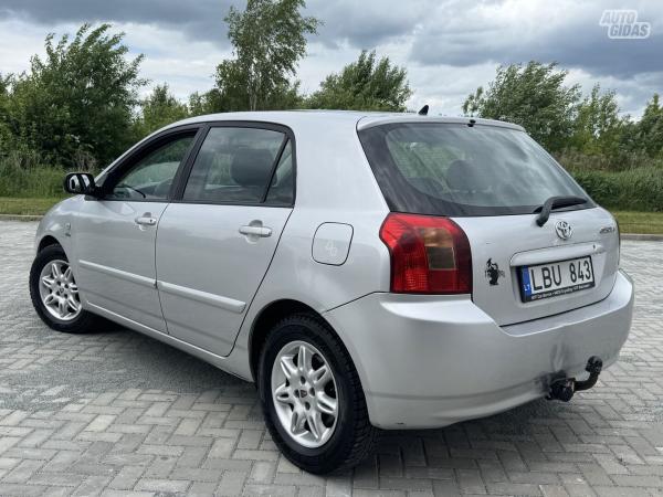 Grey Toyota Corolla 2003 in Panevezys, with an engine capacity of 2.00 L and mileage of 322 thousand km for 1050 €, photo 7 on AUTOMOTO.COM.LV