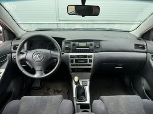 Grey Toyota Corolla 2003 in Panevezys, with an engine capacity of 2.00 L and mileage of 322 thousand km for 1050 €, photo 11 on AUTOMOTO.COM.LV