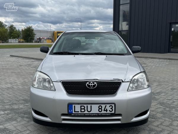 Grey Toyota Corolla 2003 in Panevezys, with an engine capacity of 2.00 L and mileage of 322 thousand km for 1050 €, photo 2 on AUTOMOTO.COM.LV