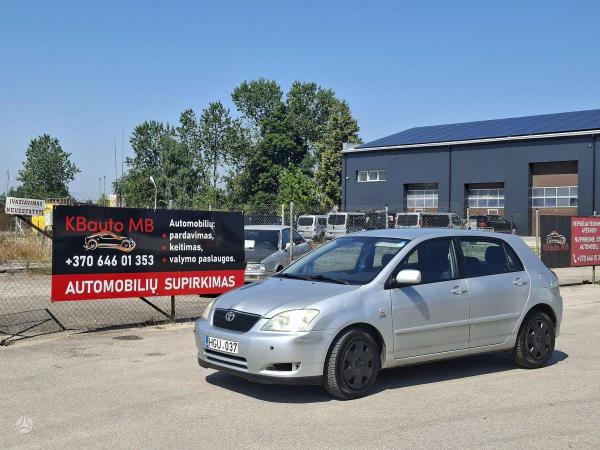 Pelēks Toyota Corolla 2003 Plungė, ar dzinēja tilpumu 2.00 L un nobraukumu 317 tūkst. km par 930 €, foto 1 vietnē AUTOMOTO.COM.LV