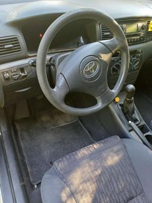 Grey Toyota Corolla 2003 in Vilnius, with an engine capacity of 1.50 L and mileage of 146 thousand km for 1500 €, photo 9 on AUTOMOTO.COM.LV