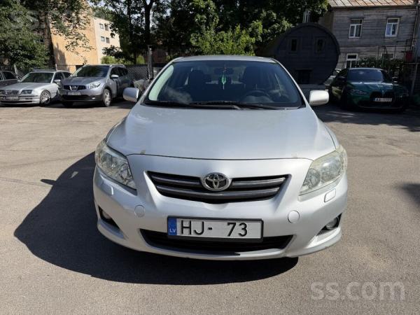 Grey Toyota Corolla 2008 in Riga, with an engine capacity of 1.40 L and mileage of 247 thousand km for 2999 €, photo 1 on AUTOMOTO.COM.LV