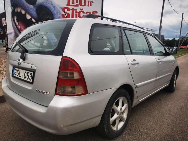 Grey Toyota Corolla 2003 in Vilnius, with an engine capacity of 2.00 L and mileage of 312 thousand km for 980 €, photo 7 on AUTOMOTO.COM.LV