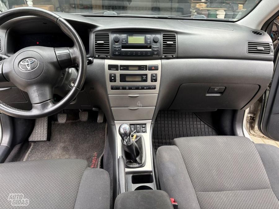Grey Toyota Corolla 2005 in Vilnius, with an engine capacity of 1.40 L and mileage of 215 thousand km for 1499 €, photo 14 on AUTOMOTO.COM.LV