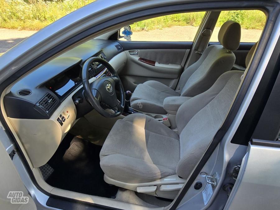 Toyota Corolla 2003 in Vilnius, with an engine capacity of 2.00 L and mileage of 219 thousand km for 1350 €, photo 10 on AUTOMOTO.COM.LV