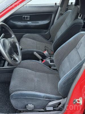 Red Toyota Corolla 1991 in Riga, with an engine capacity of 1.60 L and mileage of 180 thousand km for 9990 €, photo 13 on AUTOMOTO.COM.LV