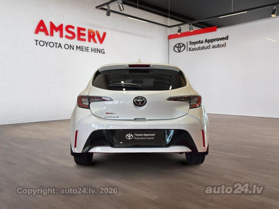 White Toyota Corolla 2021 in Tartu, with an engine capacity of 1.20 L and mileage of 90 thousand km for 13990 €, photo 5 on AUTOMOTO.COM.LV