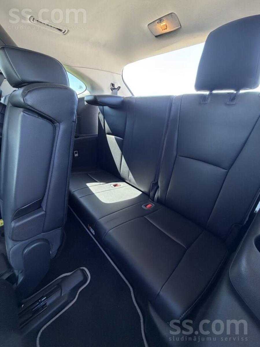 White Toyota Highlander 2021 in Riga, with an engine capacity of 2.50 L and mileage of 84 thousand km for 41900 €, photo 13 on AUTOMOTO.COM.LV