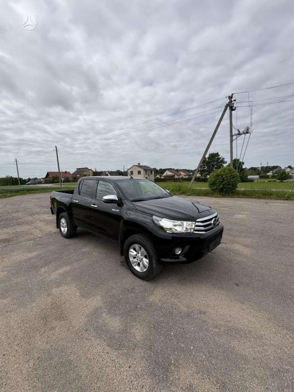Black Toyota Hilux 2020 in Kedainiai, with an engine capacity of 2.40 L and mileage of 260 thousand km for 20933 €, photo 2 on AUTOMOTO.COM.LV