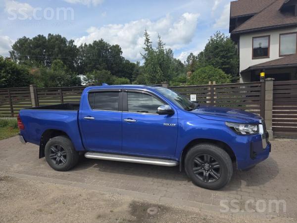 Blue Toyota Hilux 2023 in Riga, with an engine capacity of 2.40 L and mileage of 101 thousand km for 29950 €, photo 2 on AUTOMOTO.COM.LV