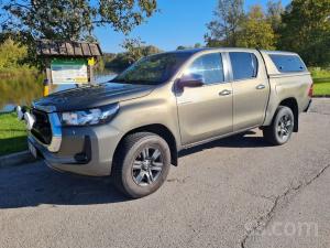Brūns Toyota Hilux 2022 Rīga, ar dzinēja tilpumu 2.80 L un nobraukumu 145 tūkst. km par 32000 €, foto  vietnē AUTOMOTO.COM.LV