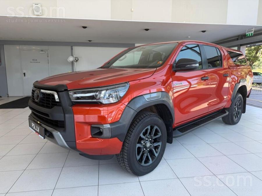 Orange Toyota Hilux 2023 in Riga, with an engine capacity of 2.80 L and mileage of 81 thousand km for 40900 €, photo 1 on AUTOMOTO.COM.LV