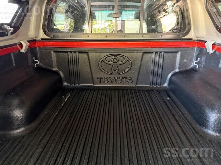 Orange Toyota Hilux 2023 in Riga, with an engine capacity of 2.80 L and mileage of 81 thousand km for 40900 €, photo 7 on AUTOMOTO.COM.LV
