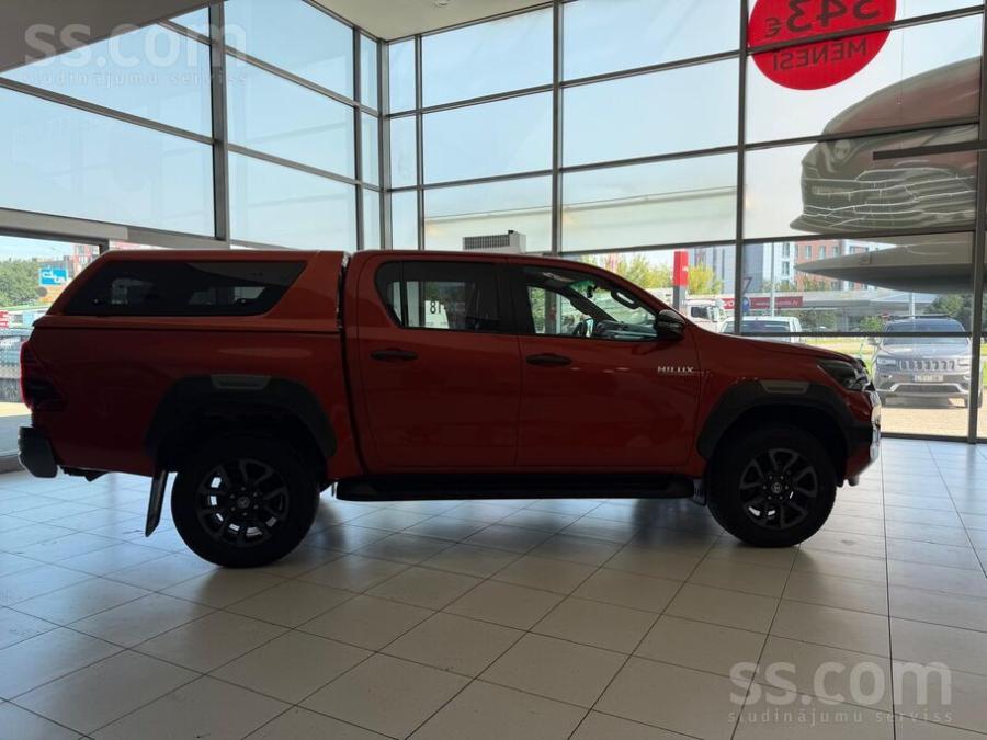 Orange Toyota Hilux 2023 in Riga, with an engine capacity of 2.80 L and mileage of 81 thousand km for 40900 €, photo 9 on AUTOMOTO.COM.LV