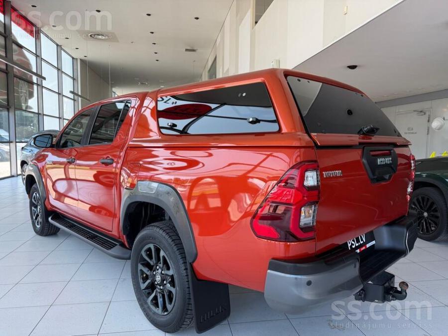 Orange Toyota Hilux 2023 in Riga, with an engine capacity of 2.80 L and mileage of 81 thousand km for 40900 €, photo 17 on AUTOMOTO.COM.LV