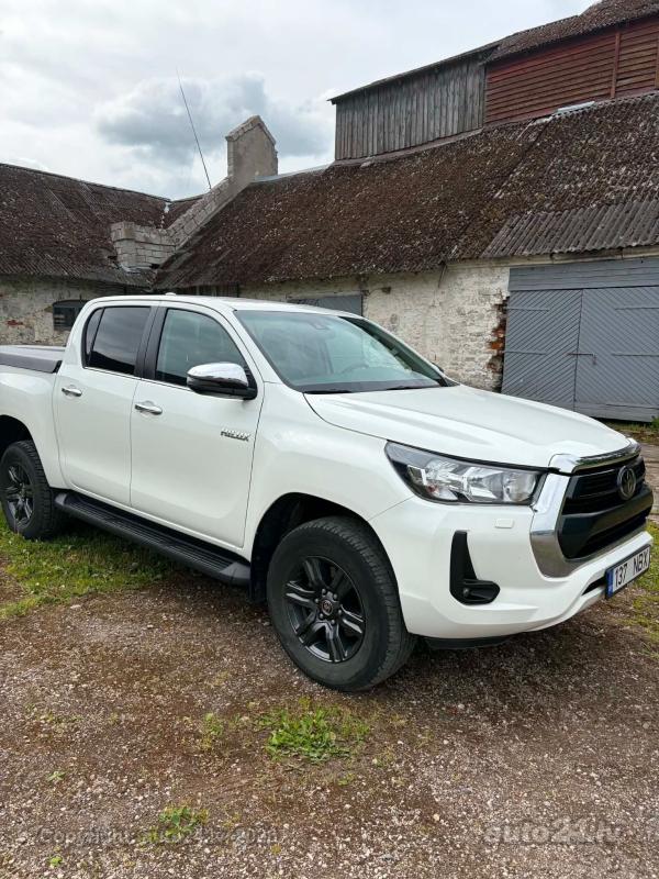 White Toyota Hilux 2024 in Tallinn, with an engine capacity of 2.40 L and mileage of 60 thousand km for 44800 €, photo 2 on AUTOMOTO.COM.LV