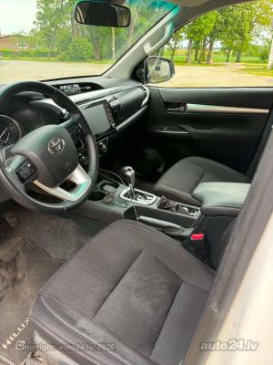 White Toyota Hilux 2024 in Tallinn, with an engine capacity of 2.40 L and mileage of 60 thousand km for 44800 €, photo 4 on AUTOMOTO.COM.LV