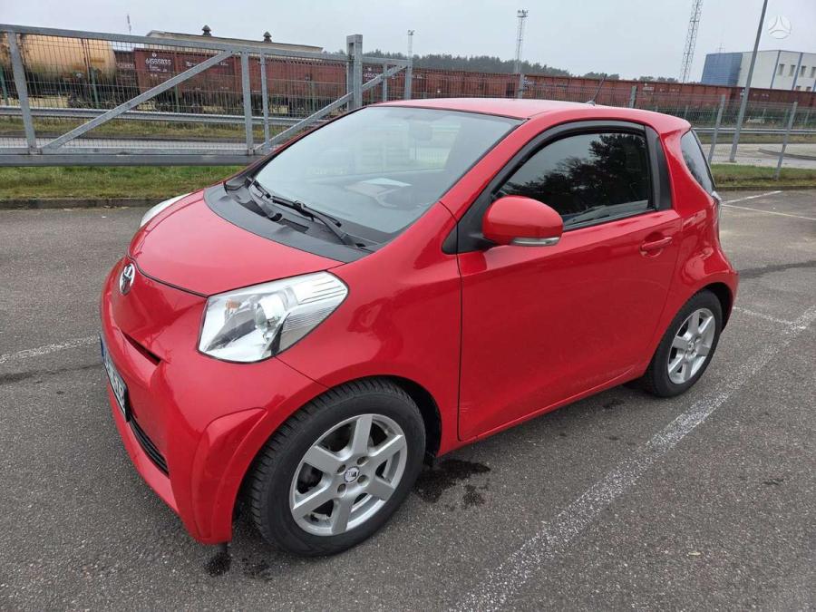 Red Toyota IQ 2012 in Vilnius, with an engine capacity of 1.00 L and mileage of 97 thousand km for 3800 €, photo 1 on AUTOMOTO.COM.LV