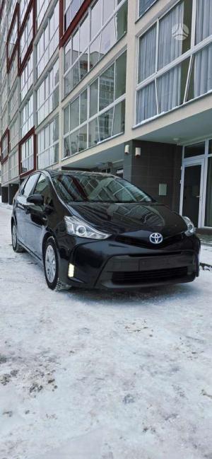Black Toyota Prius 2016 in Vilnius, with an engine capacity of 1.80 L and mileage of 288 thousand km for 11400 €, photo 2 on AUTOMOTO.COM.LV