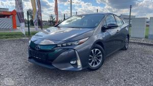 Grey Toyota Prius 2018 in Marijampole, with an engine capacity of 1.80 L and mileage of 185 thousand km for 13990 €, photo  on AUTOMOTO.COM.LV