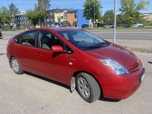 Sarkans Toyota Prius 2008 Panevēža, ar dzinēja tilpumu 1.50 L un nobraukumu 214 tūkst. km par 4200 €, foto  vietnē AUTOMOTO.COM.LV