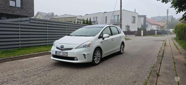 White Toyota Prius 2013 in Vilnius, with an engine capacity of 1.80 L and mileage of 224 thousand km for 7900 €, photo 3 on AUTOMOTO.COM.LV