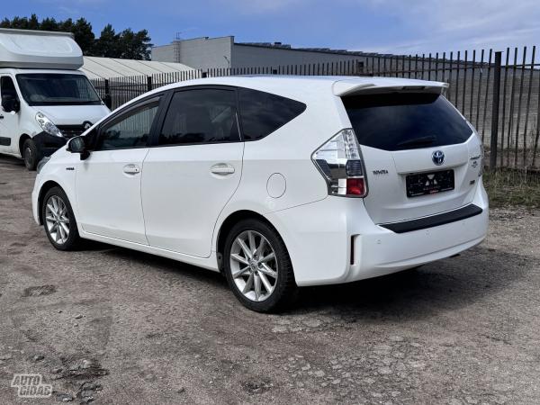 White Toyota Prius 2015 in Vilnius, with an engine capacity of 1.80 L and mileage of 407 thousand km for 7950 €, photo 3 on AUTOMOTO.COM.LV