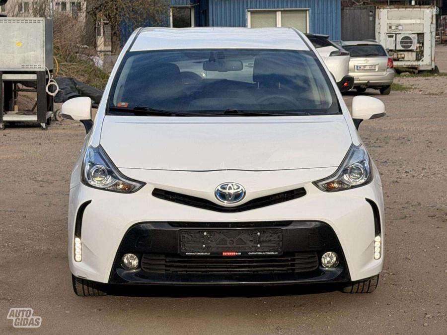 White Toyota Prius 2016 in Vilnius, with an engine capacity of 1.80 L and mileage of 488 thousand km for 8950 €, photo 4 on AUTOMOTO.COM.LV