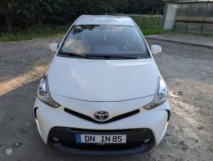 White Toyota Prius 2018 in Klaipeda, with an engine capacity of 1.80 L and mileage of 276 thousand km for 12800 €, photo  on AUTOMOTO.COM.LV