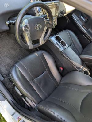 White Toyota Prius 2018 in Klaipeda, with an engine capacity of 1.80 L and mileage of 276 thousand km for 12800 €, photo 19 on AUTOMOTO.COM.LV